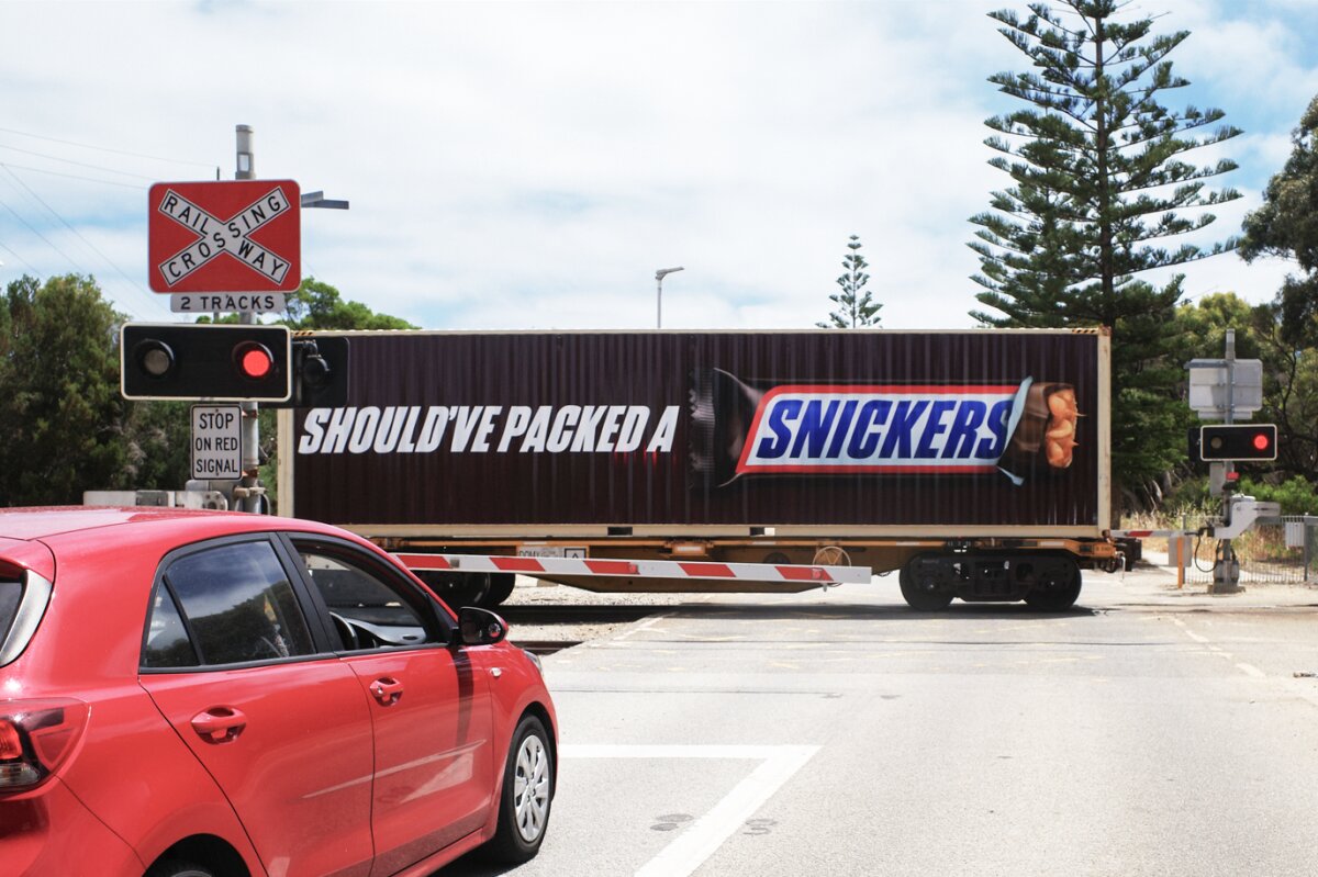 World’s-first SNICKERS® moving billboard on rails, transforms a WA ...